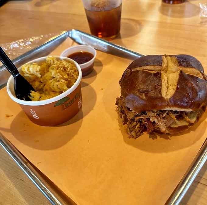 That pulled pork sandwich towers so high it practically needs its own zip code and architectural support.