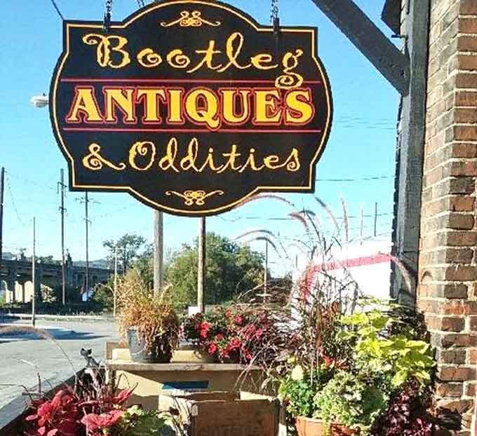 The "Bootleg Antiques & Oddities" sign promises exactly what it delivers, and that ampersand is doing some serious heavy lifting.