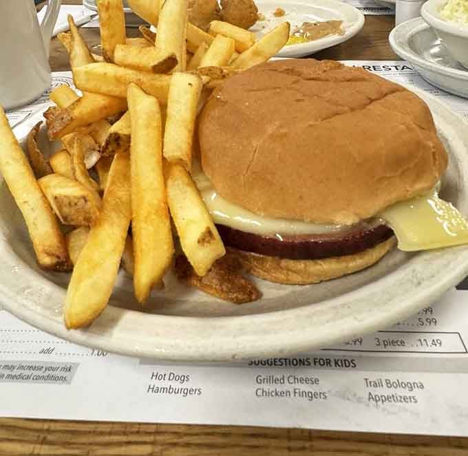 That bologna sandwich with a mountain of fries isn't messing around about portion sizes or flavor.