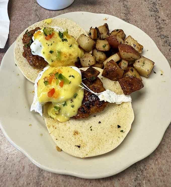 Portuguese Eggs Benedict topped with hollandaise&mdash;because regular eggs Benedict apparently wasn't fancy enough for this Massachusetts morning masterpiece.
