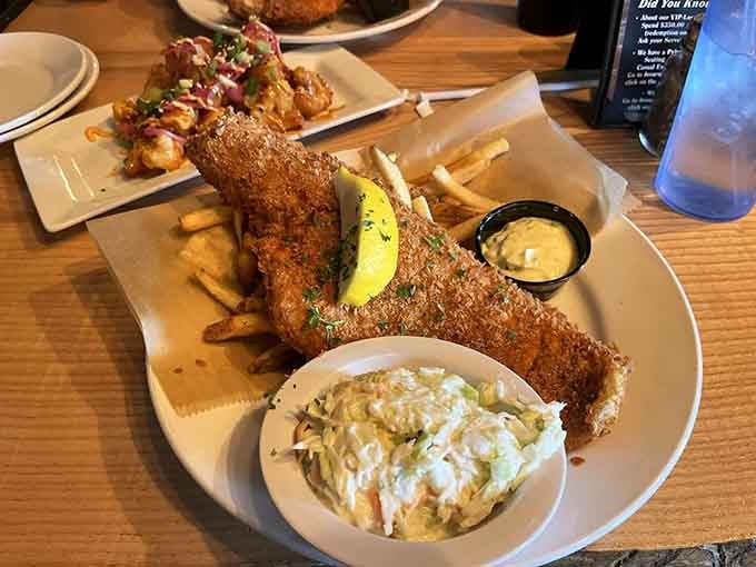 Golden fried fish with proper crispy coating and coleslaw that actually looks fresh, not like it's been waiting since Tuesday.