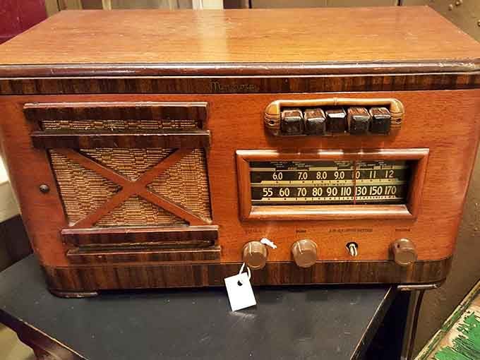 This wooden radio cabinet could've broadcast Fibber McGee and Molly, its warm finish still gleaming with mid-century pride.
