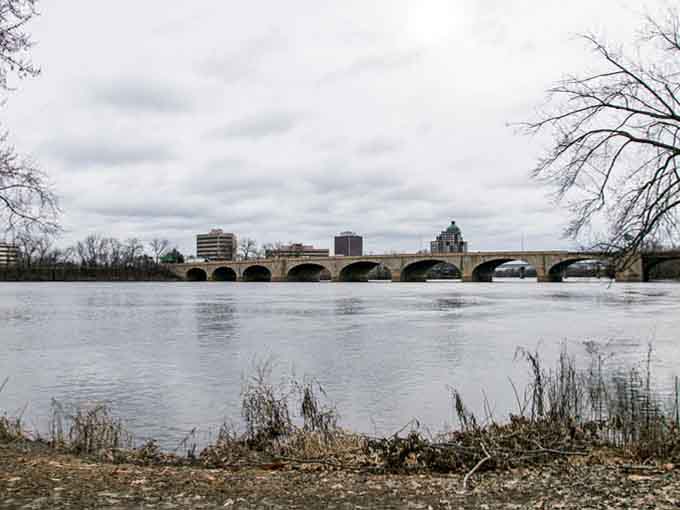 Winter transforms the bridge into a study in contrasts&mdash;warm stone against cold water, permanence meeting change.