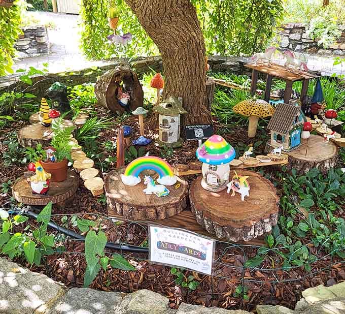 This miniature neighborhood features rainbow mushrooms and unicorns, because apparently fairies have excellent taste in lawn ornaments.