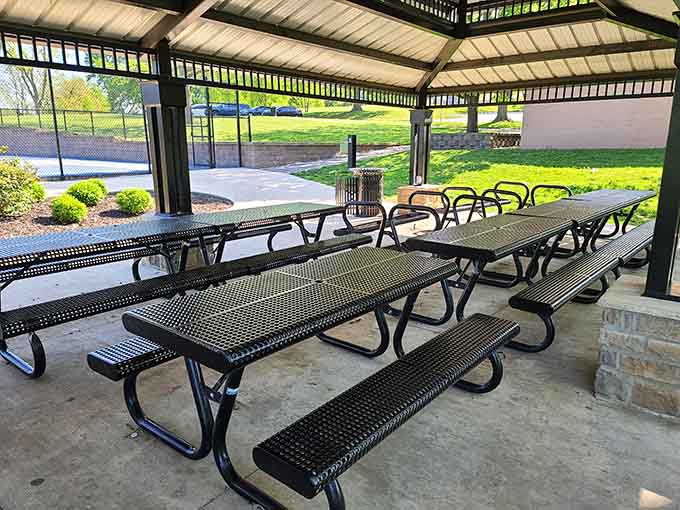 Picnic tables under shelter, ready for your potato salad and whatever weather Missouri decides to throw.