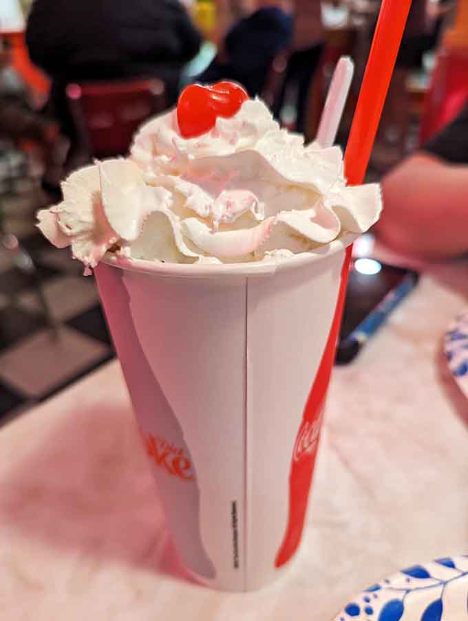 That swirl of cream looks like soft-serve architecture designed by someone who really understands dessert physics.