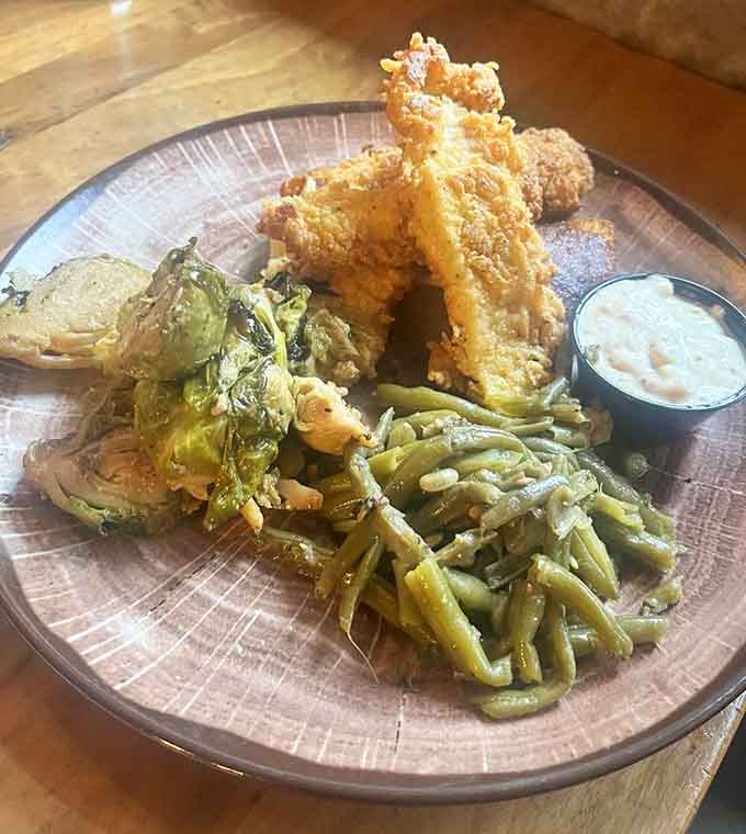 Golden catfish, crispy Brussels sprouts, and green beans that actually look appetizing. Nature never tasted so civilized.