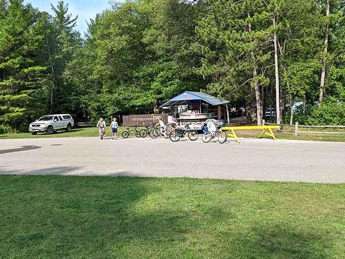 Families pedal past Sleeper State Park's facilities, where the hardest decision is beach first or bike trail exploration.