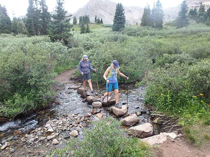 Creek crossings add adventure to the journey, though your feet might have different opinions about the whole stepping-stone situation here.