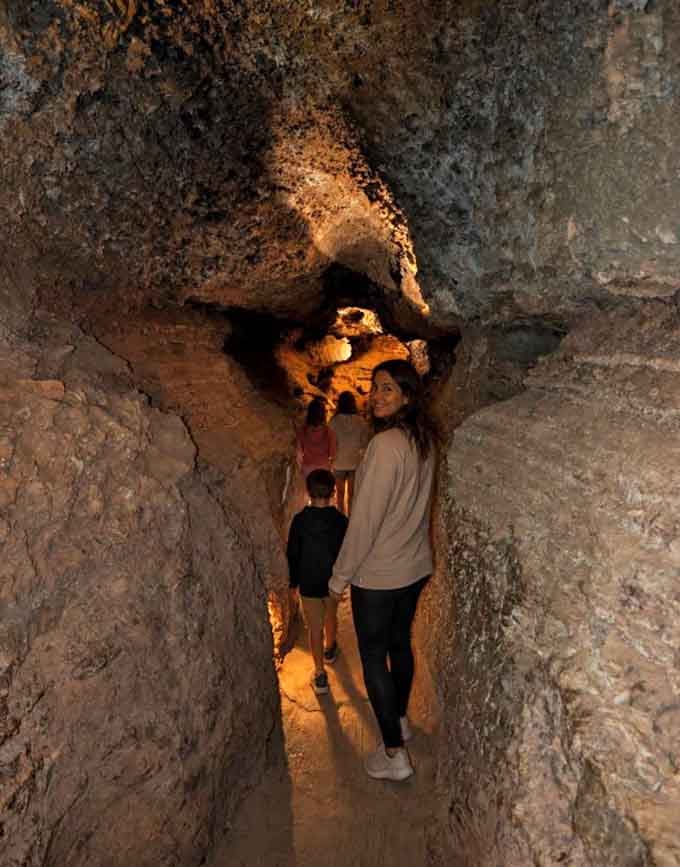 Nothing says family bonding like squeezing through ancient rock passages together while questioning your recent snack choices.