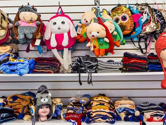 Those adorable animal backpacks staring at you from the wall are basically daring you to resist their charm. Spoiler: you can't.