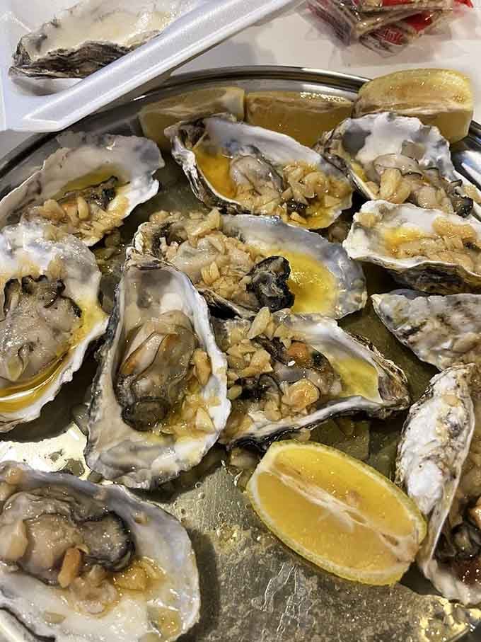 Fresh oysters on the half shell with garlic butter and lemon wedges, because sometimes simple is simply perfect.
