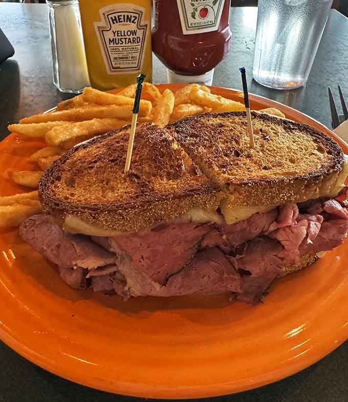 A proper Reuben on marble rye with those perfect grill marks—this is what deli dreams are made of, folks.