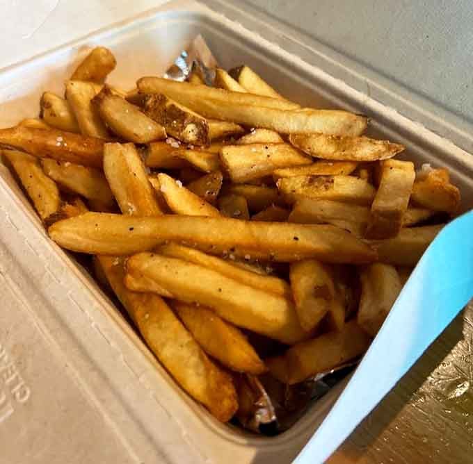 Golden, crispy, and perfectly seasoned, these fries are the supporting actor that steals the whole show.