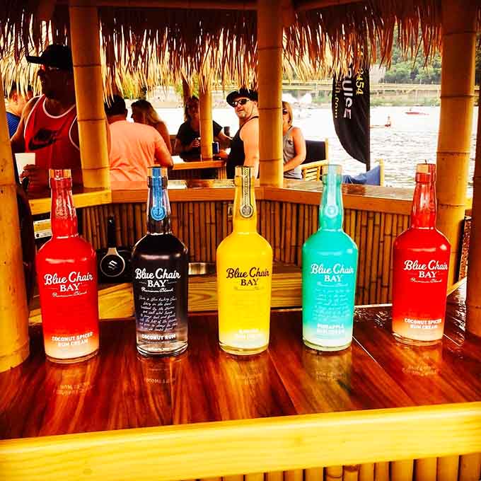 Blue Chair Bay bottles lined up like colorful soldiers ready to make your river cruise infinitely more interesting and tropical.