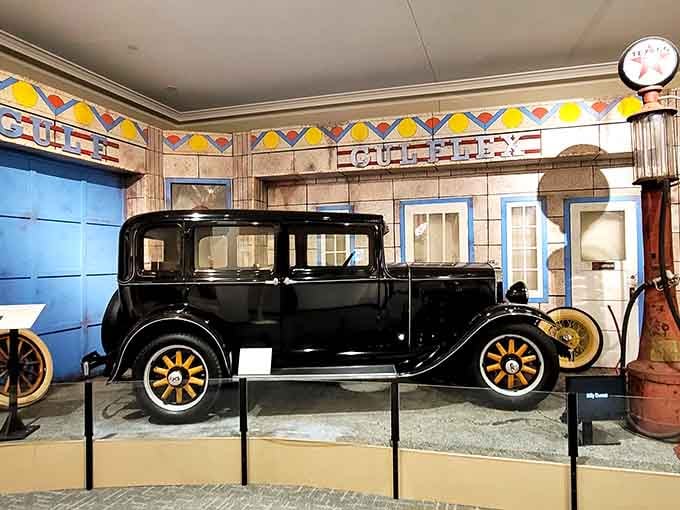 That vintage automobile sits in Art Deco splendor, reminding us when gas stations were architectural masterpieces worth photographing.