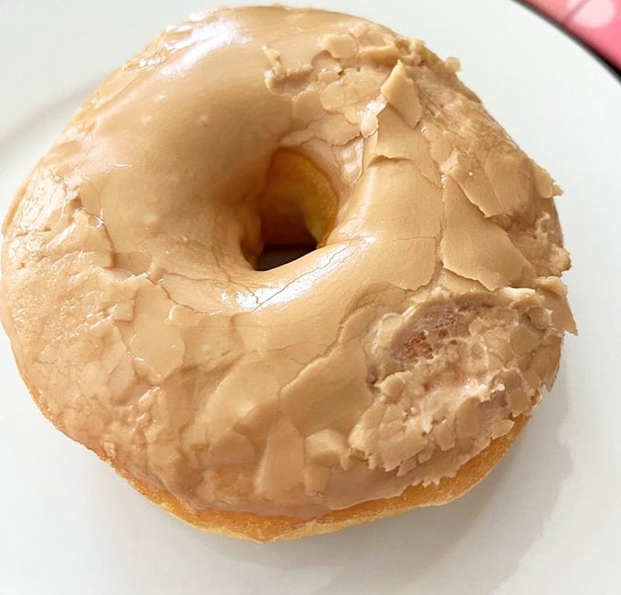This maple-glazed beauty wears its frosting like a crown, thick and unapologetically indulgent.