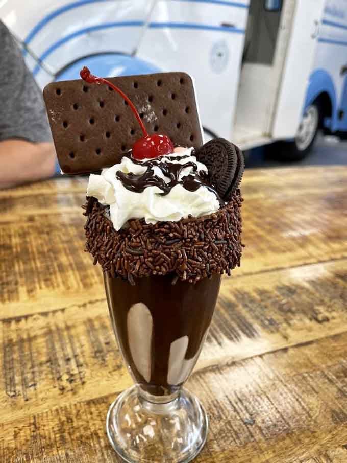 This chocolate creation towers like a delicious skyscraper with cookies, cream, and zero structural engineering permits.