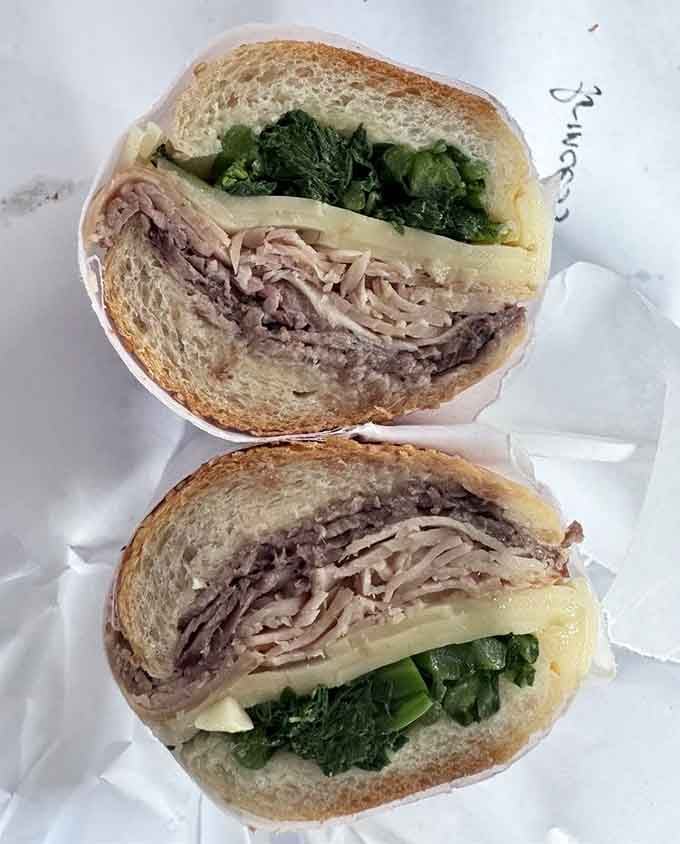 Roast pork and broccoli rabe piled high, proof that the best things in life don't need fancy packaging.