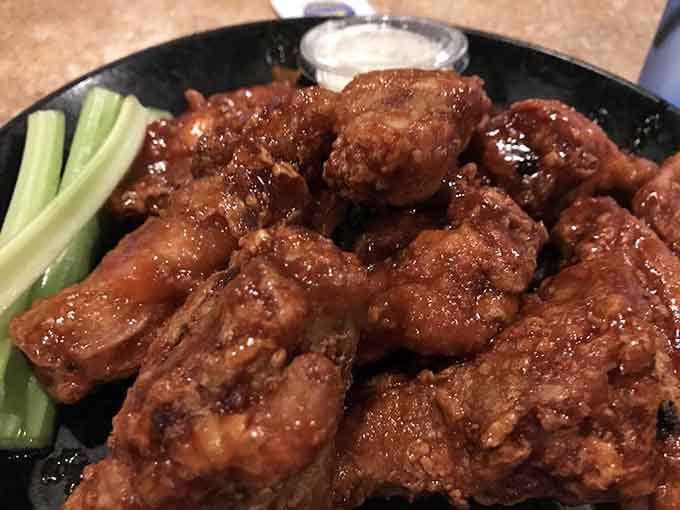 Honey BBQ wings glistening with that perfect sweet-savory glaze that makes napkins completely optional (but highly recommended for polite company).