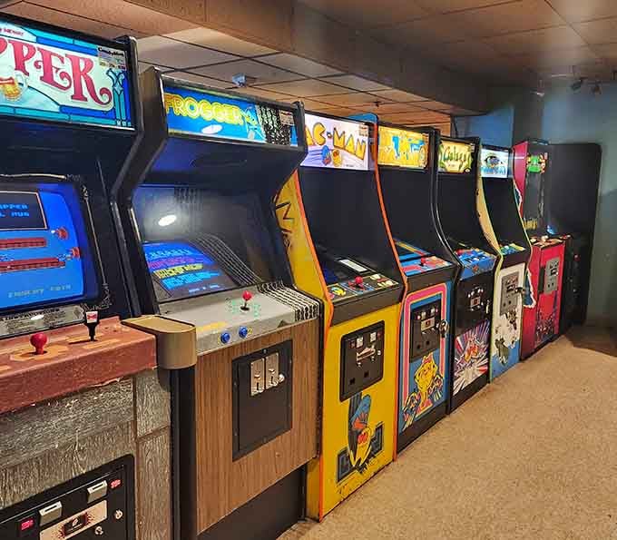 Classic cabinets standing shoulder to shoulder, a rainbow of vintage gaming glory that defined an entire generation's childhood dreams.