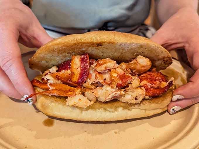 This lobster roll is stuffed so generously, it's practically bursting at the seams with sweet, tender meat.