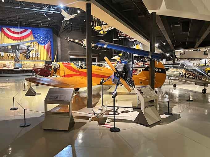 Vintage aircraft lined up like they're waiting for takeoff, each one telling stories our grandparents would recognize.