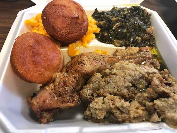 Golden cornbread muffins sitting pretty next to perfectly seasoned chicken that would make your grandmother weep with joy and pride.