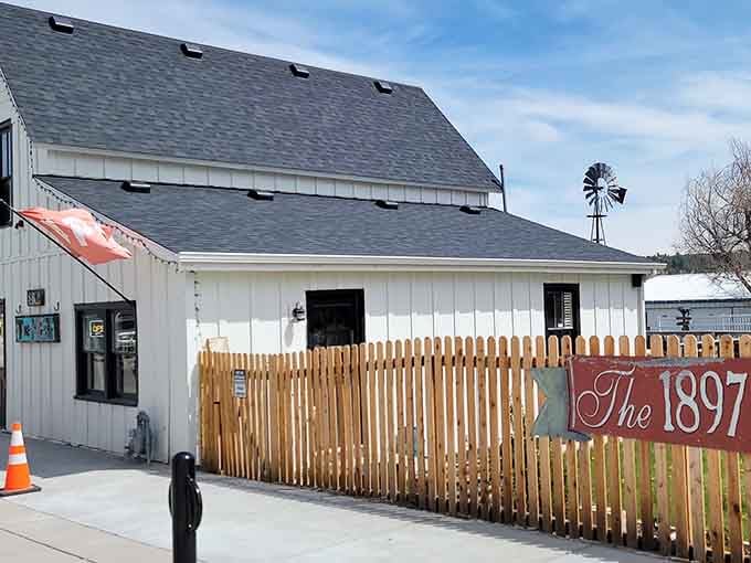 The picket fence and windmill give The 1897 House all the classic farmhouse charm you could ask for.