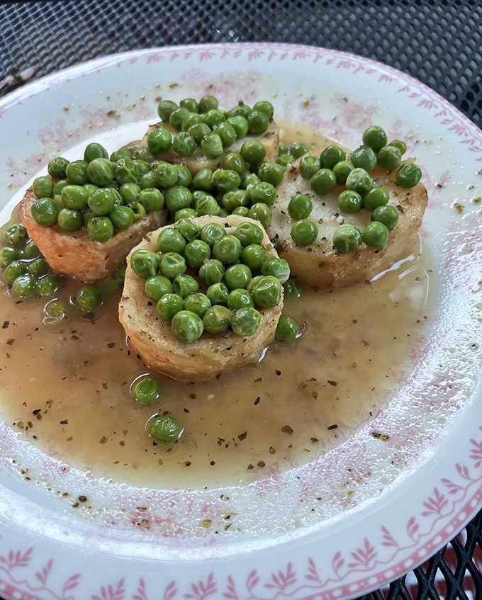 Those peas perched atop tender medallions look almost too pretty to eat. Almost.