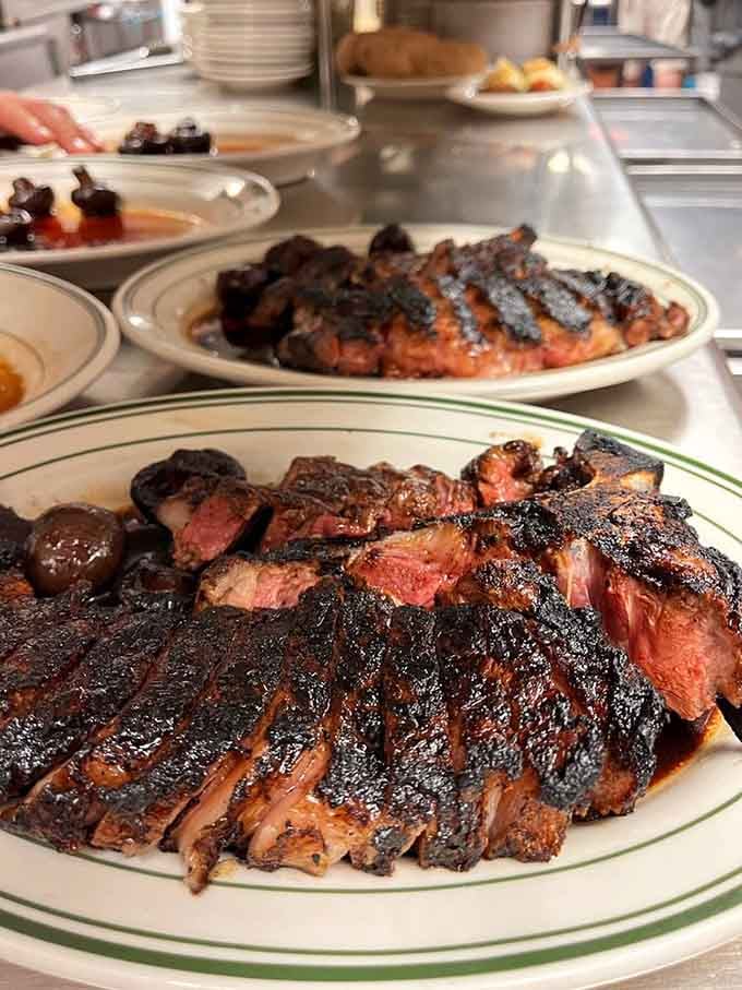 When your steak arrives with its own spotlight moment, you know you've ordered right.