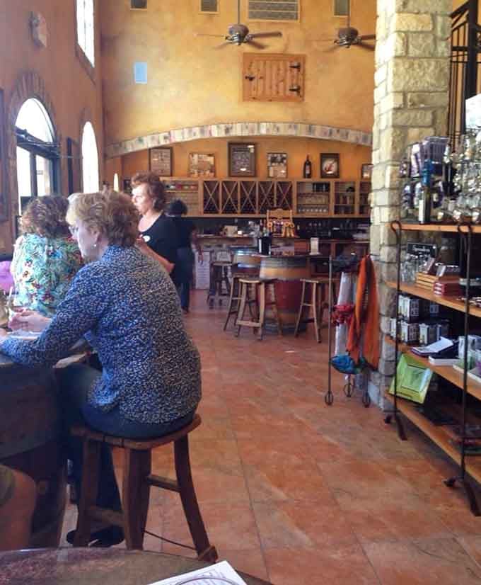 The tasting bar where strangers become friends over shared glasses and good conversation.