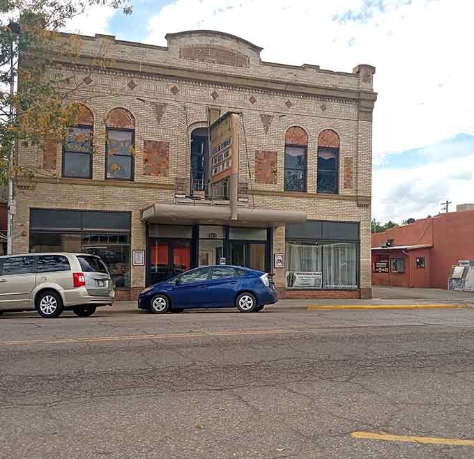 The old theater marquee and decorative brickwork remind you that entertainment once meant getting dressed up and walking downtown for the evening.