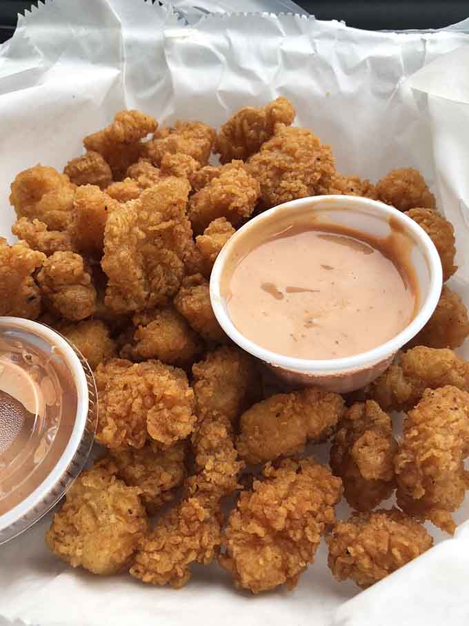 These grouper bites are like ocean candy, crispy outside and tender inside, served with sauce for dipping pleasure.