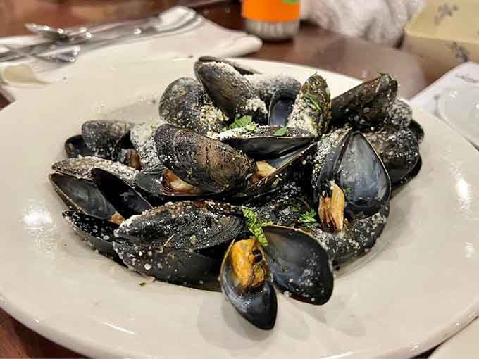 These mussels glisten like tiny treasures from the sea, ready to disappear in record time.