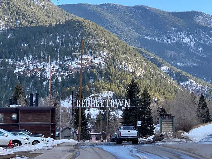 That welcome sign isn't overselling anything, the town behind it delivers exactly what it promises: authentic mountain town magic.