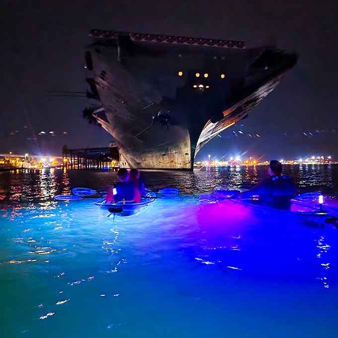 Paddling past historic ships while glowing like a jellyfish is peak Corpus Christi energy, friends.