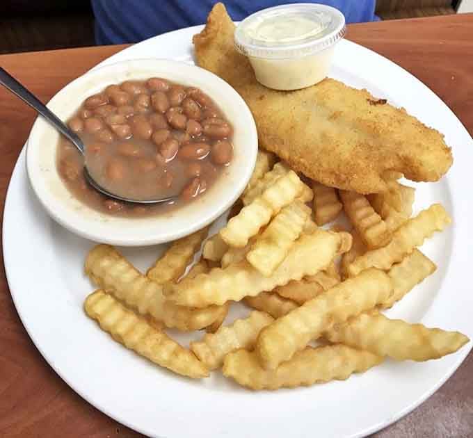 Golden fried cod with crinkle fries and beans delivers comfort food that tastes like childhood, only better.