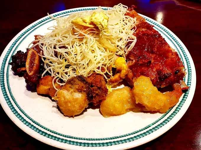 Rice vermicelli meets crispy delights in a plate that proves variety is indeed the spice of life.