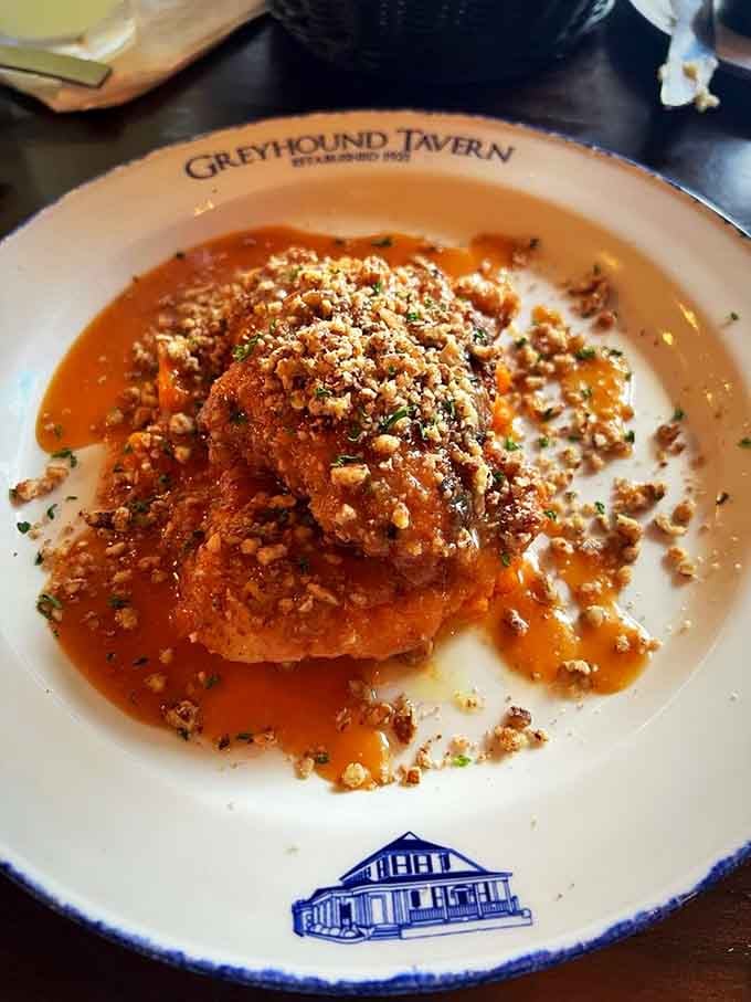 Pecan-crusted chicken swimming in bourbon caramel sauce proves that sometimes fancy and delicious can actually coexist peacefully.