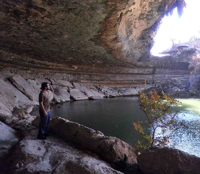 Standing beneath this limestone overhang feels like discovering a secret room in nature's mansion nobody told you about.