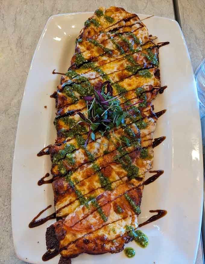 Beautifully plated flatbread drizzled with balsamic that would make any Italian grandmother nod with approval and maybe smile.