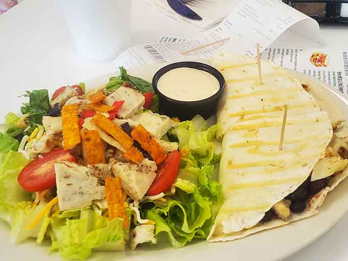 Fresh greens topped with grilled chicken and a quesadilla because sometimes you need both lunch options.