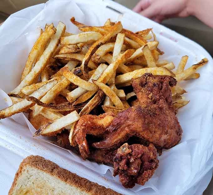 That mountain of fries knows it's playing second fiddle to the chicken, and it's completely fine with that.