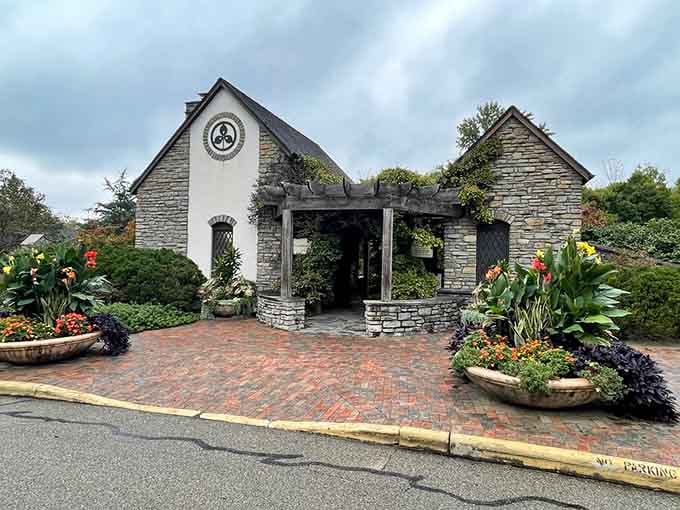 The charming gatehouse entrance sets the storybook tone, looking like it belongs in a European village rather than suburban Cincinnati.