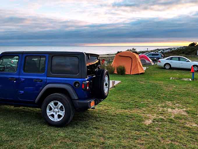 Sunset camping where your tent neighbors the ocean, making every morning feel like a luxury resort minus the bill.