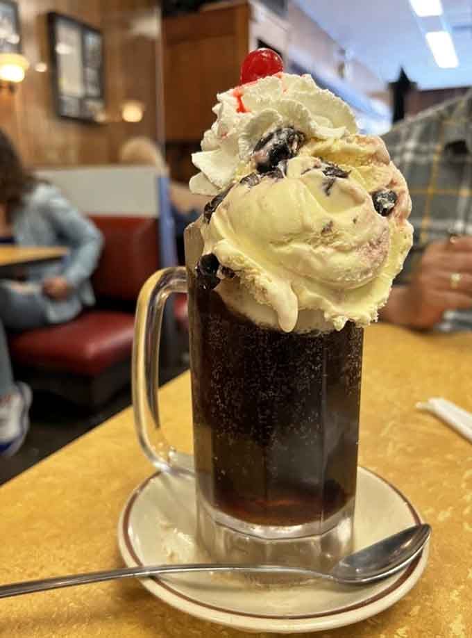 An ice cream soda towering with vanilla and root beer reminds you why some inventions never need improving.