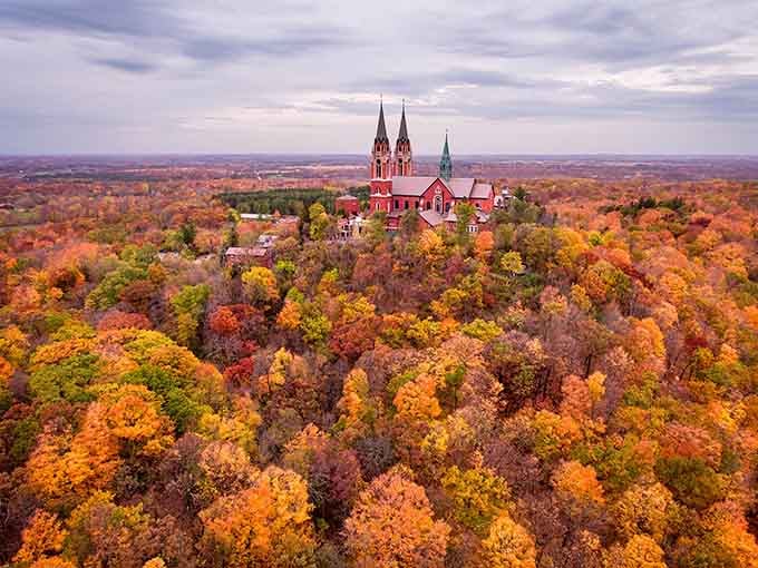 Autumn transforms Holy Hill into a postcard that makes even professional photographers question their career choices and equipment.