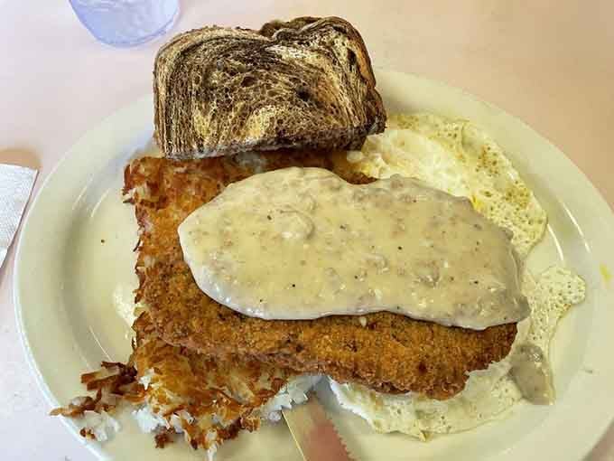 Country fried steak smothered in gravy, proving that some comfort foods never go out of style for good reason.