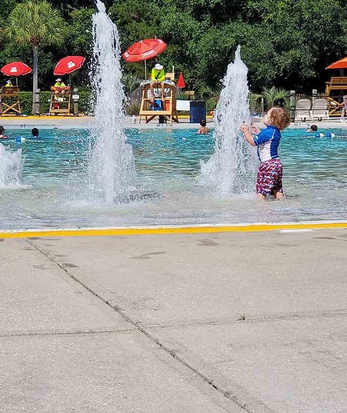 Pure joy captured in motion as tiny humans discover the magic of unexpected water fountains everywhere.